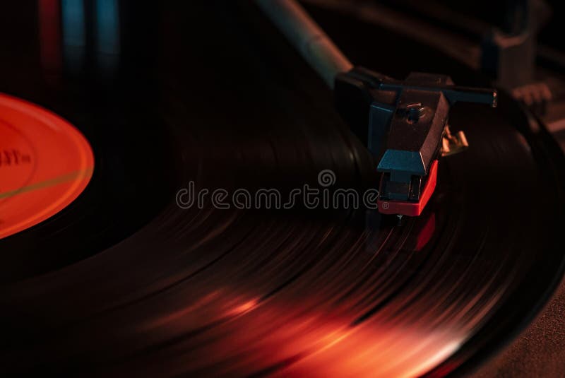 Vinyl Record Spinning on Turntable with Red Light Effect Stock ...
