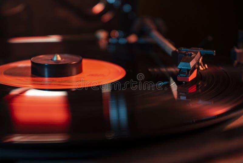 Vinyl Record Spinning on Turntable with Red Light Effect Stock ...