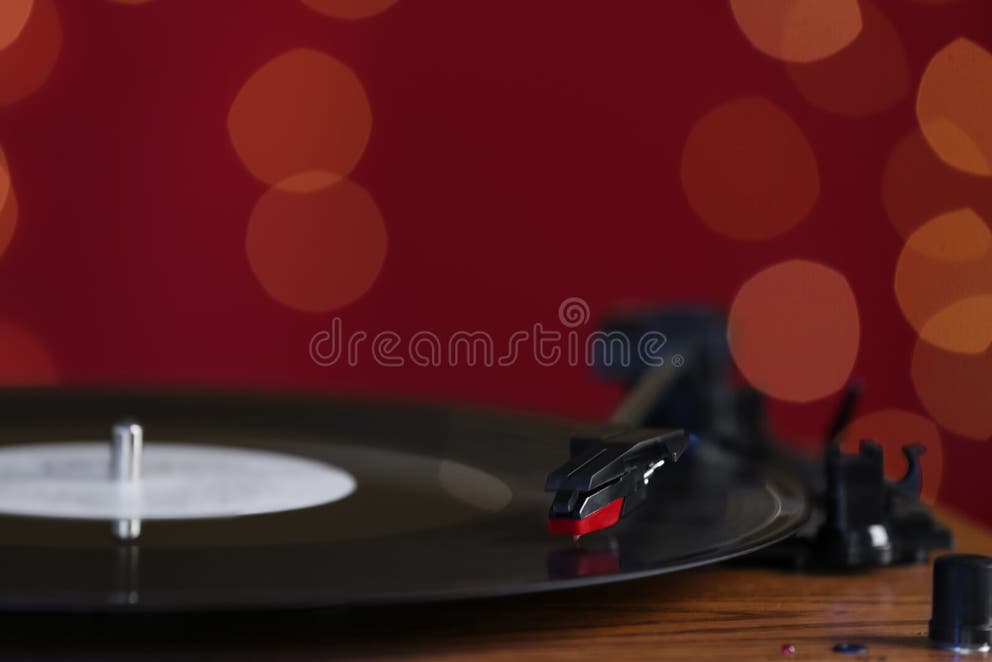 Vinyl Record on Turntable Against Blurred Lights, Closeup. Space for ...