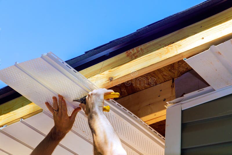 Vinyl Soffit Plastic Panels into Facade Ceiling of a New House by an ...