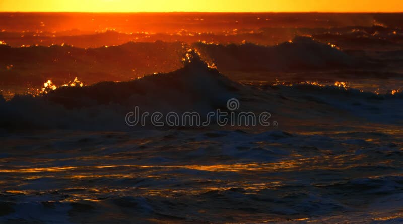 Violent Waves Form in the Ocean Under the Rays of Sunset Stock Image ...