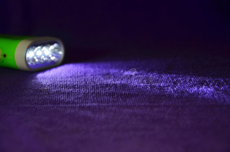 Violet Clothes Floor in the Light of Flashlight Stock Image - Image of ...