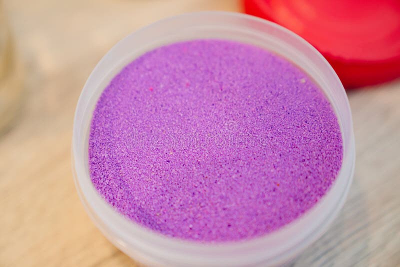 Violet Colored Sand in a Container for Crafts and Souvenirs. Stock ...