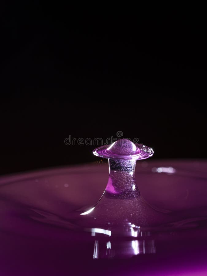 Violet Drop of Water with Black Background Stock Image - Image of ...