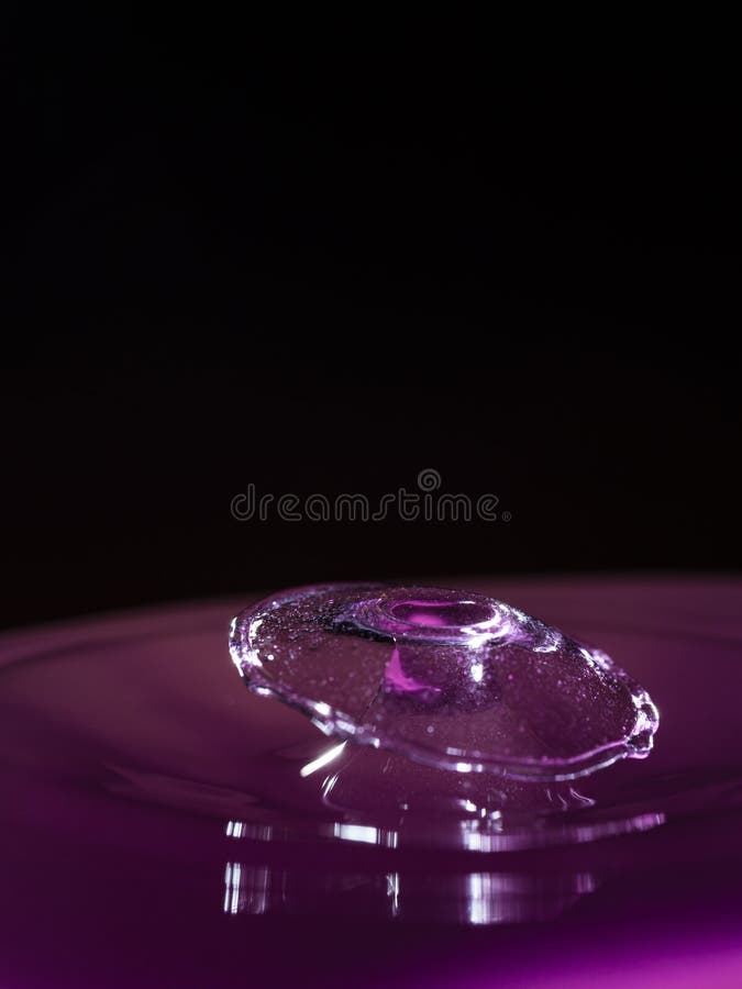 Violet Drop of Water with Black Background Stock Image - Image of ...