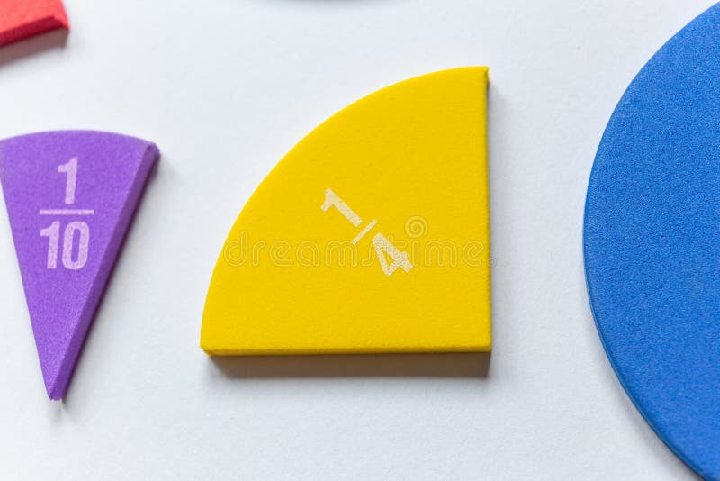 Violet Orange Yellow Pieces of Fractions on the Table. Close Up Math ...