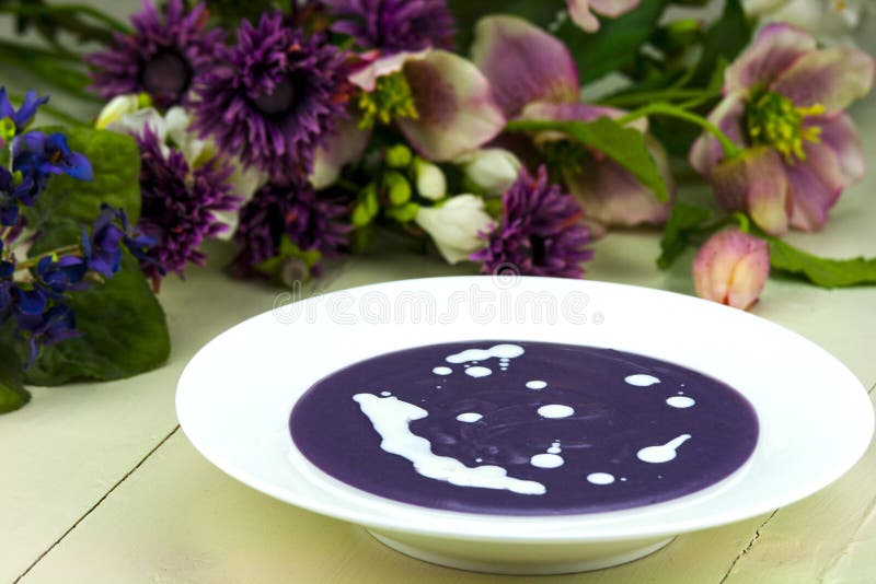 Violet Potato and Leek Soup with Cream Stock Image - Image of flower ...