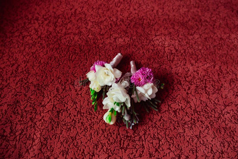Violet and White Boutonnieres Lie on Red Carpet Stock Image - Image of ...