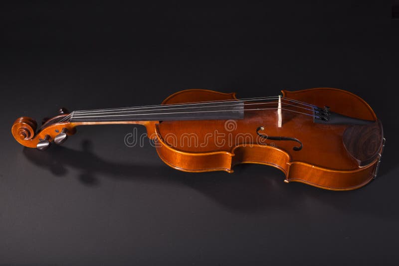 A Violin and its Shadow stock image. Image of table, strings - 59904275