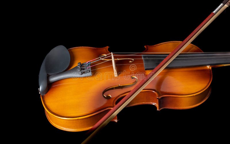 Violin with Bow on Strings Isolated on Black Background. Stock Image ...