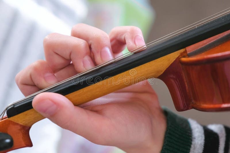 Violin in Boy`s Hands. Boy is Learning To Play Violin Stock Photo ...