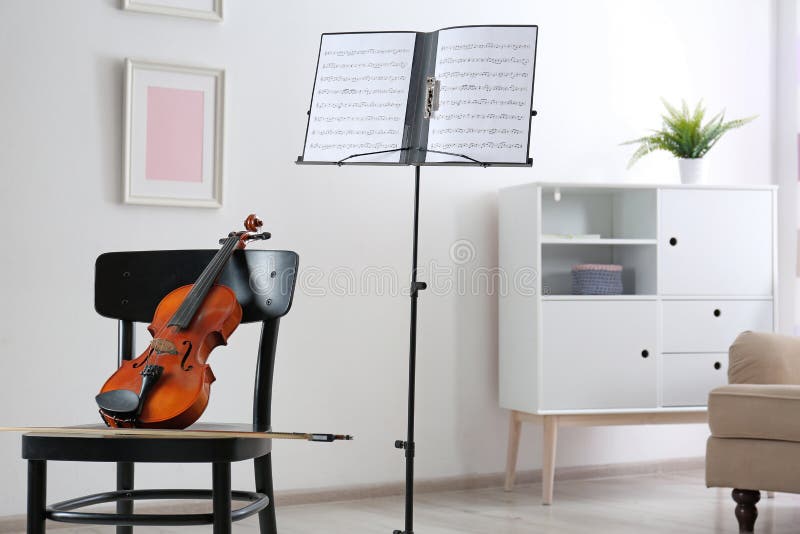 Violin, Chair and Note Stand with Music Sheets Stock Photo - Image of ...