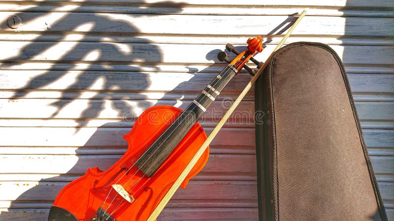 A Violin and its Shadow stock image. Image of table, strings - 59904275