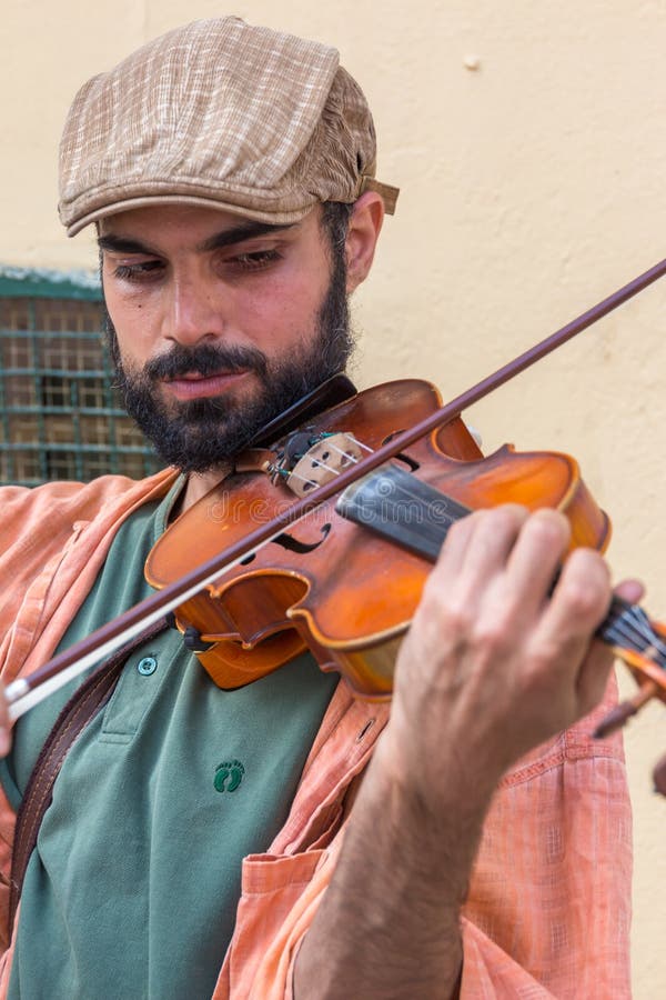A violin man on the street editorial stock photo. Image of sound - 56265888