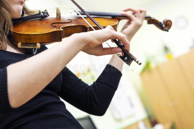 Violinist Girl Learns a Piece from Notes in a Music Class. Stock Image ...