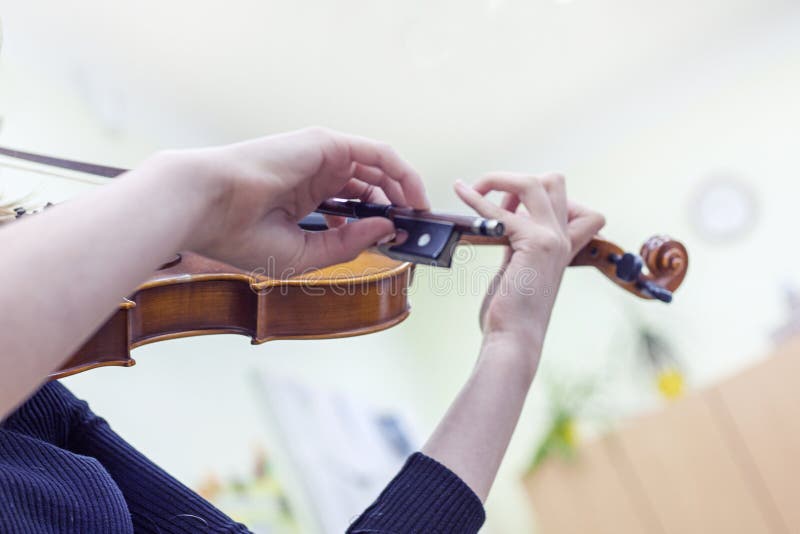 Violinist Girl Learns a Piece from Notes in a Music Class. Stock Image ...