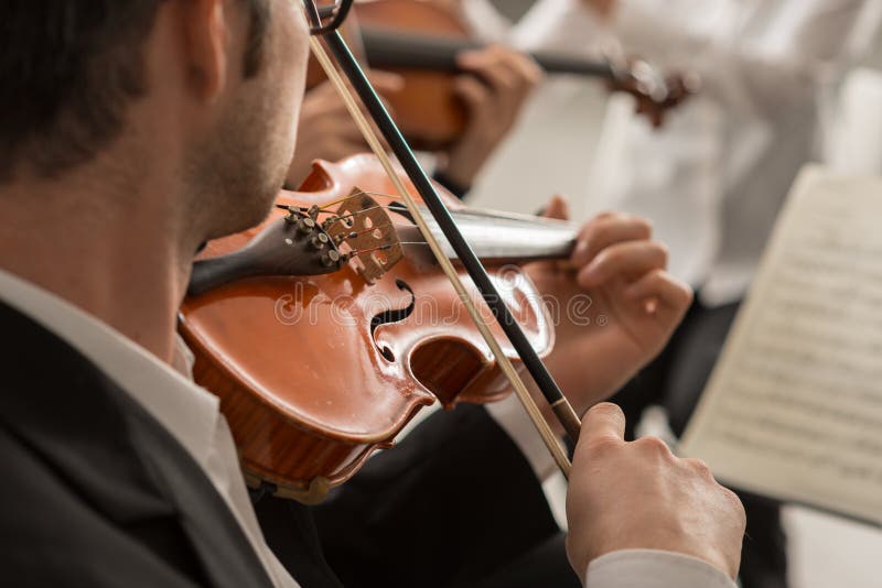Violinist Performing on Stage with Orchestra Stock Image - Image of ...