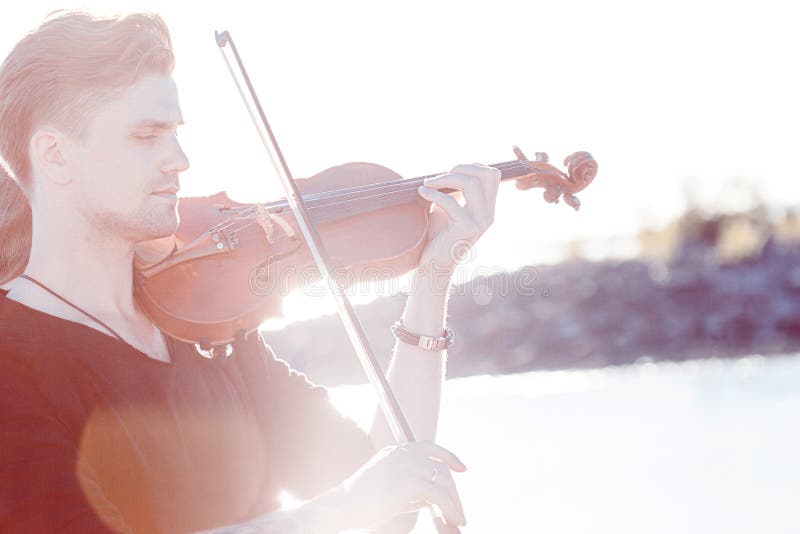 Violinist Playing a Violin, Young Man Plays on Stock Image - Image of ...