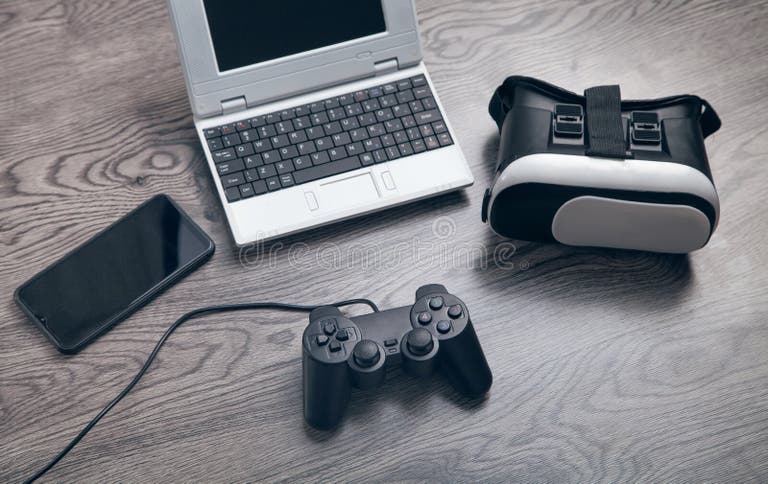 Virtual Reality Goggles, Joystick, Laptop, Smartphone Stock Photo ...