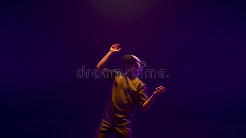 Virtual Reality Player Dancing in Neon Lights Closeup. Energetic Man ...