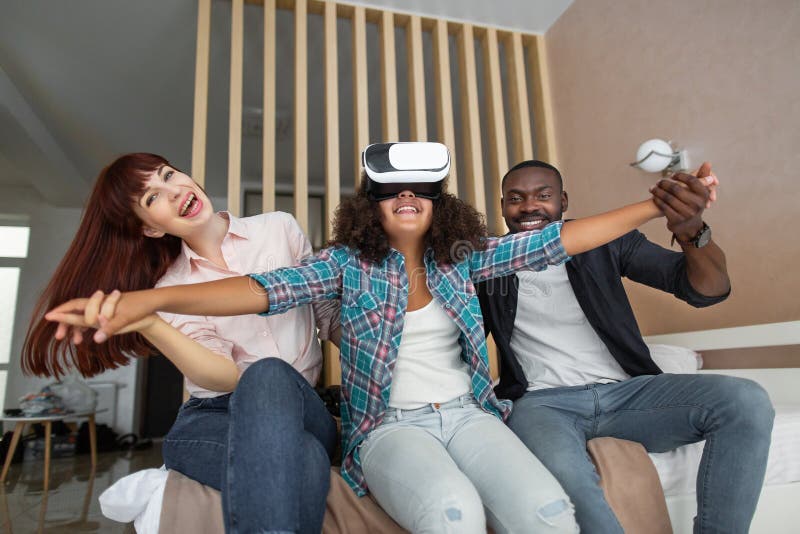 Multiethnic Family of Three Having Fun Using VR Glasses. Mother and ...