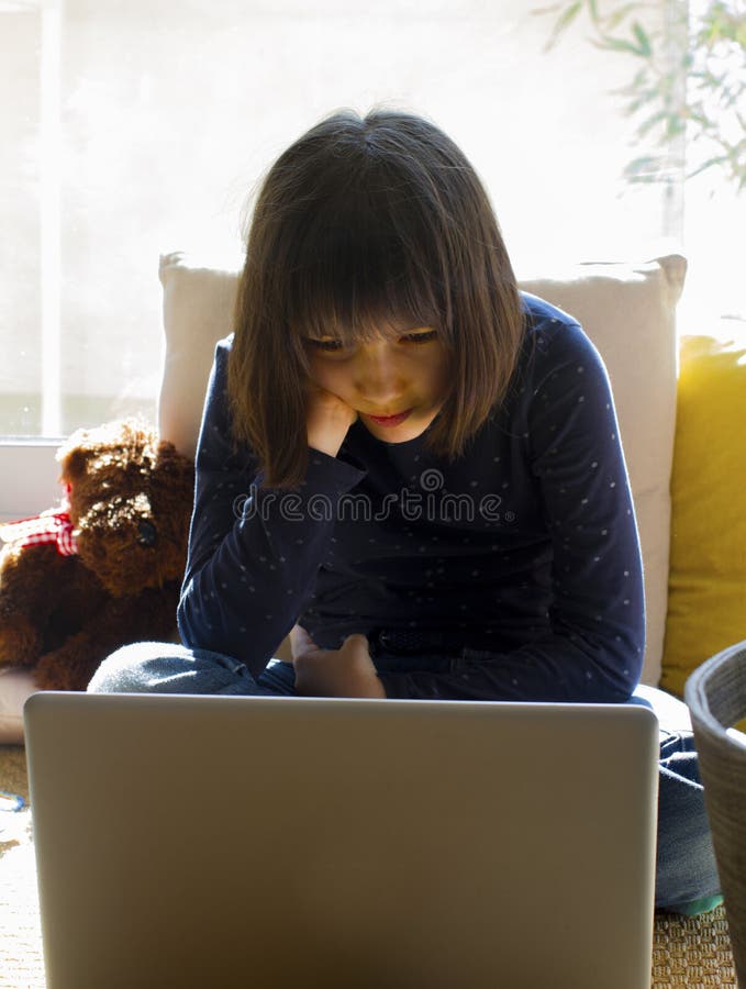 Virus Outbreak Education - Smiling Child Hypnotized by Computer Screen ...