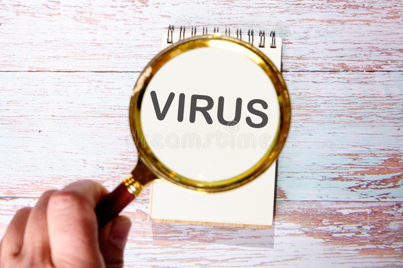 VIRUS Text Seen through Magnifying Glasses on a Notepad Stock Photo ...