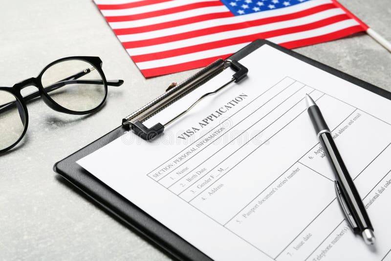 Visa Application Form, Glasses and American Flag on Light Grey Table ...