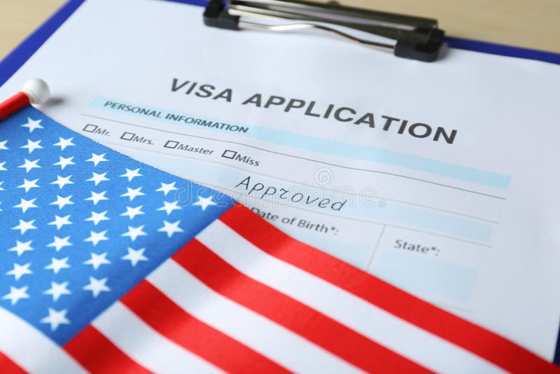 Visa Application Form for Immigration and American Flag on Table ...