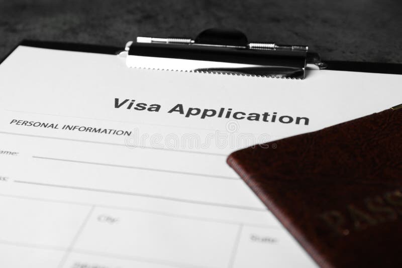 Visa Application Form for Immigration and Passport on Grey Table ...