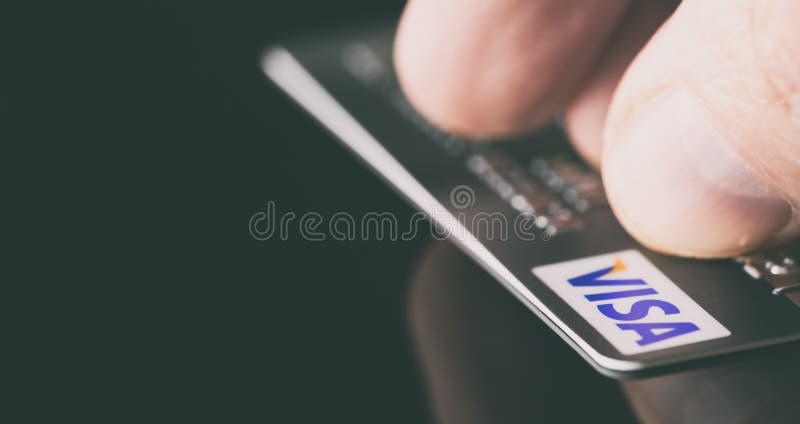 VISA card in hand editorial stock photo. Image of closeup - 100165163