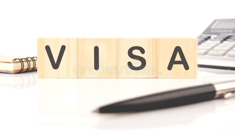 VISA Word Assembled from Wooden Cubes Next To a Calculator, Pen and ...