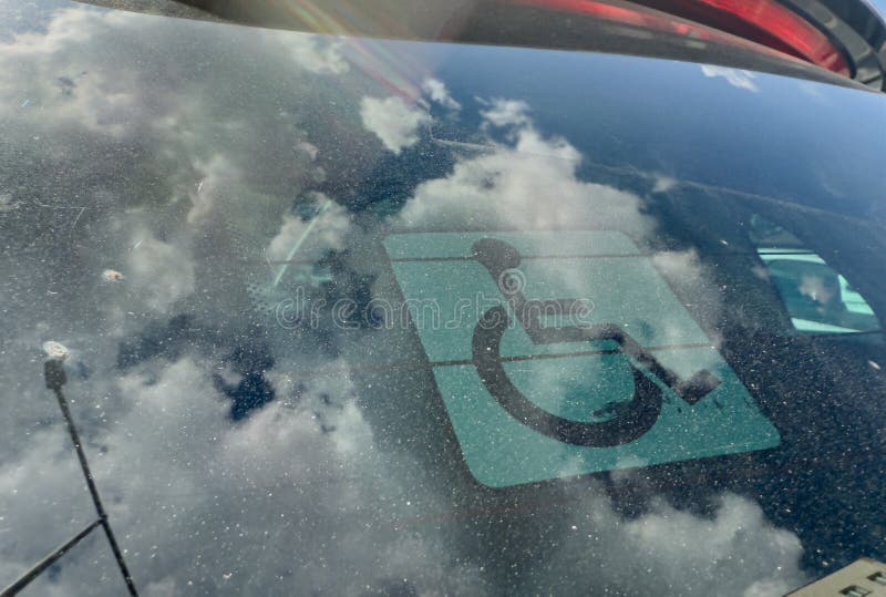 Visible Disability Placard Placed Behind a Car Windshield. Sign ...