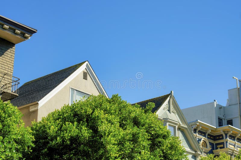 Visible Rooftops in Row with Decorative Stucco Facades with Gable Style ...