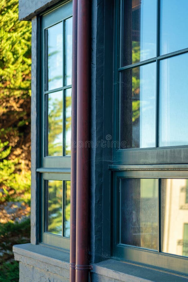 Visible Windows on Front of House or Building with Dark Red Metal Rain ...