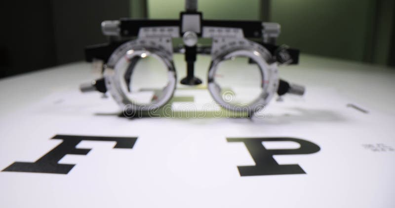 Vision Screening Device Put on Vision Snellen Chart on Table Stock ...