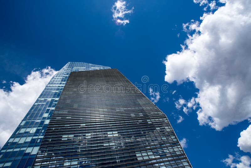Visionary Skyscraper with Reflections of Clouds on Windows Stock Photo ...
