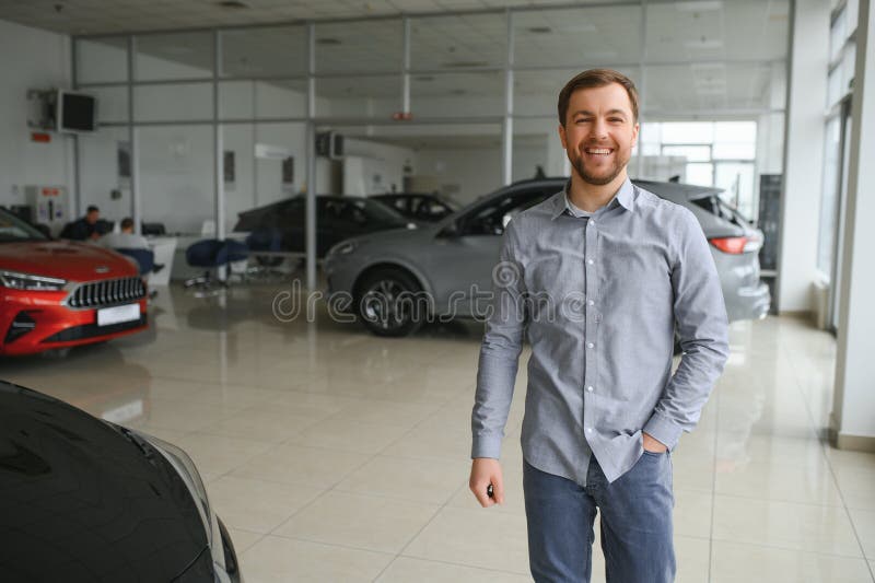 Visiting Car Dealership. Handsome Bearded Man is Stroking His New Car ... Visiting Car Dealership. Handsome Bearded Man is Stroking His New Car ...