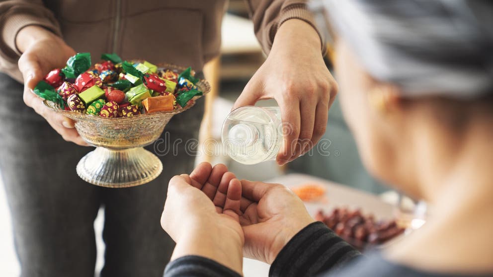 Visiting Relatives and Offering Treats during Ramadan Stock Image ...