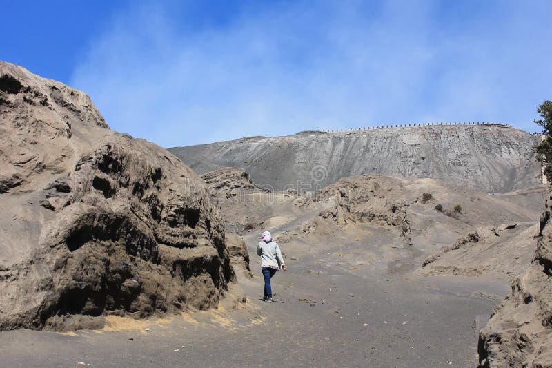 A Visitor is Climbing Mount Bromo Blue Sky Stock Photo - Image of ...