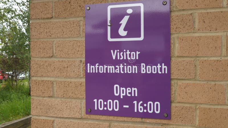Visitor Information Booth Sign on Brick Wall Stock Footage - Video of ...