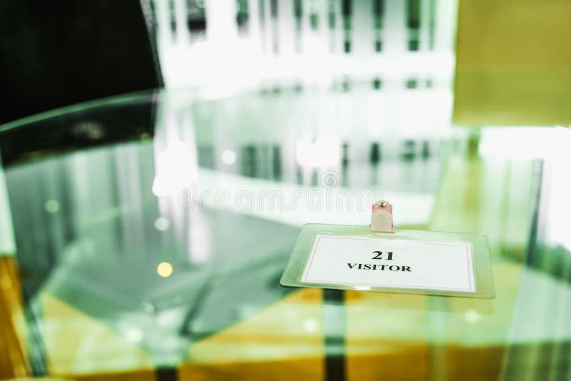 Visitor Plastic Card on Glass Table Stock Photo - Image of press, room ...
