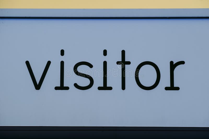 Visitor sign painted blue stock image. Image of written - 84360975