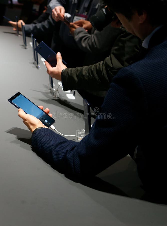 Visitors Testing New Mobile Models at the Mobile World Congress 2019 in ...
