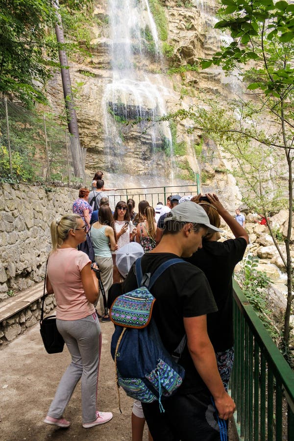 Visitors at the waterfall editorial stock image. Image of green - 139831324