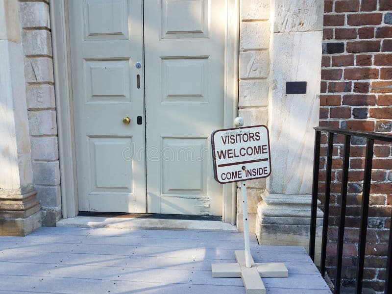 Visitors Welcome Come Inside Sign and White Door Stock Image - Image of ...