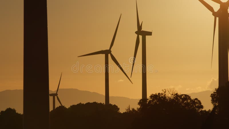 Visual Environmental Impact with Wind Turbines in Mountains Silhouette ...