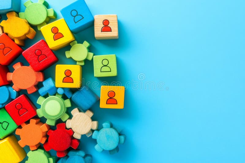 A Visual of Multicolored Blocks with Human Icons Placed on a Wooden ...