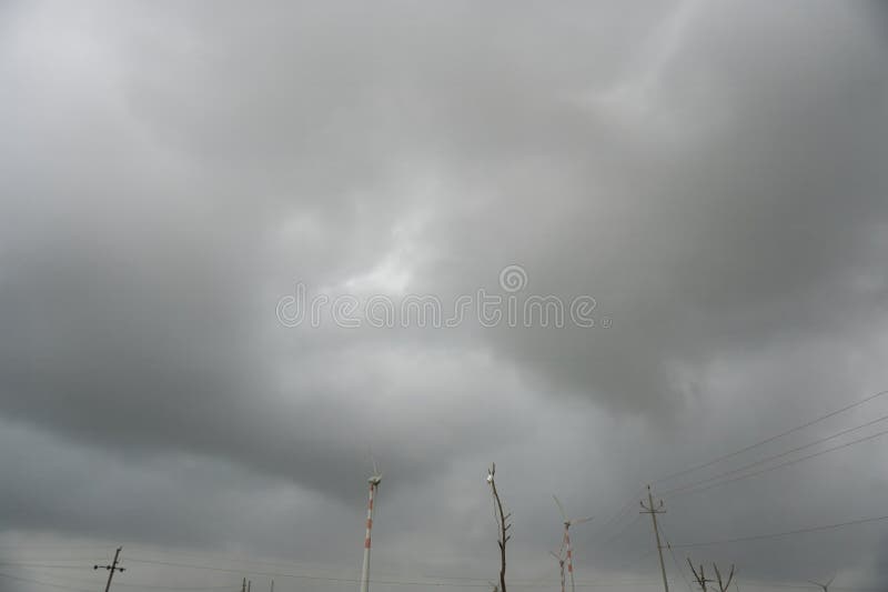 Dull Skies Featuring Fleeting Highlights Above the Shadowy Power Lines ...