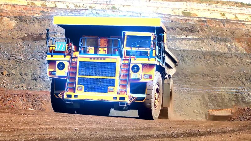 Quarry Truck Driving on the Road in Deep Quarry. a Large Mining Truck ...